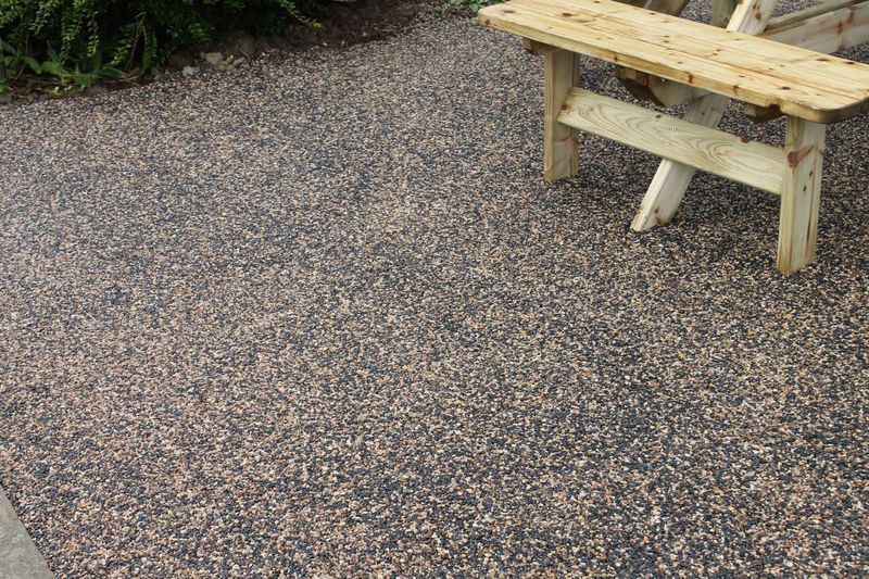 Recycled rubber and aggregate surfacing for seating area | Addagrip ...
