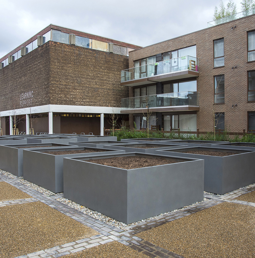 Large bespoke steel planters for residential development | IOTA | ESI ...