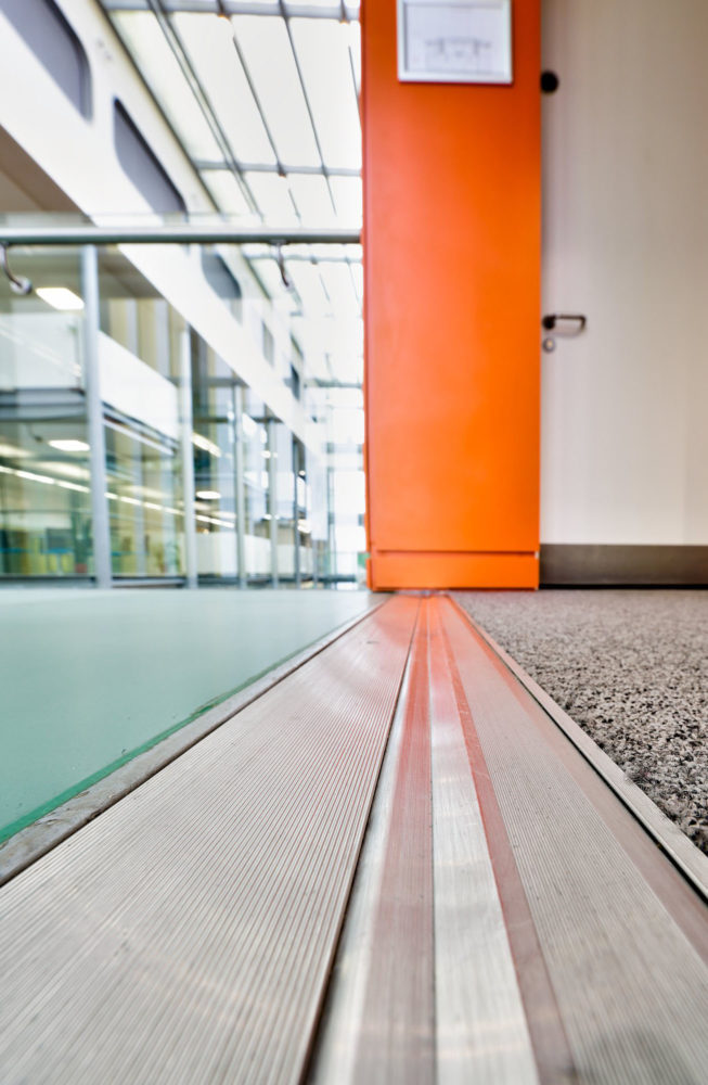 Custom expansion joint for glass walkways | Construction Specialties ...