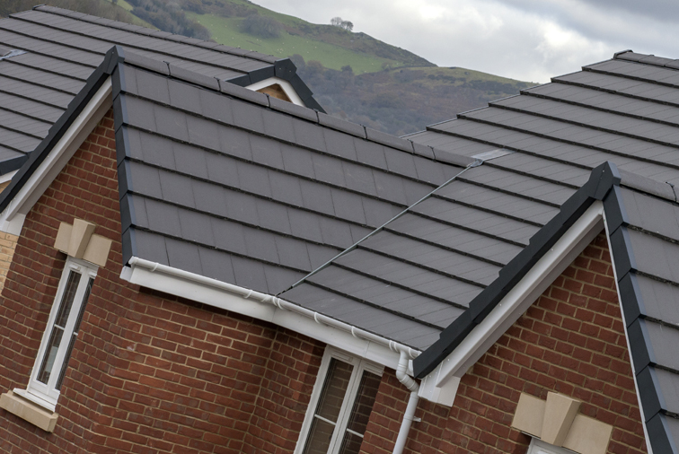 Interlocking roof tiles for new housing development | Marley | ESI ...