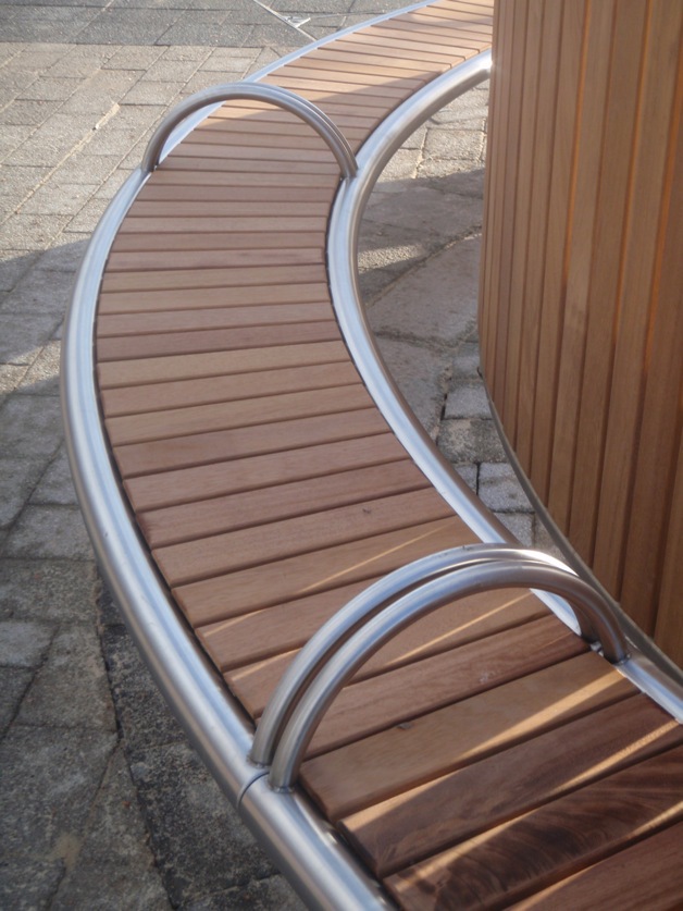 Shoreline SL008 curved stainless steel and timber bench | Benchmark ...