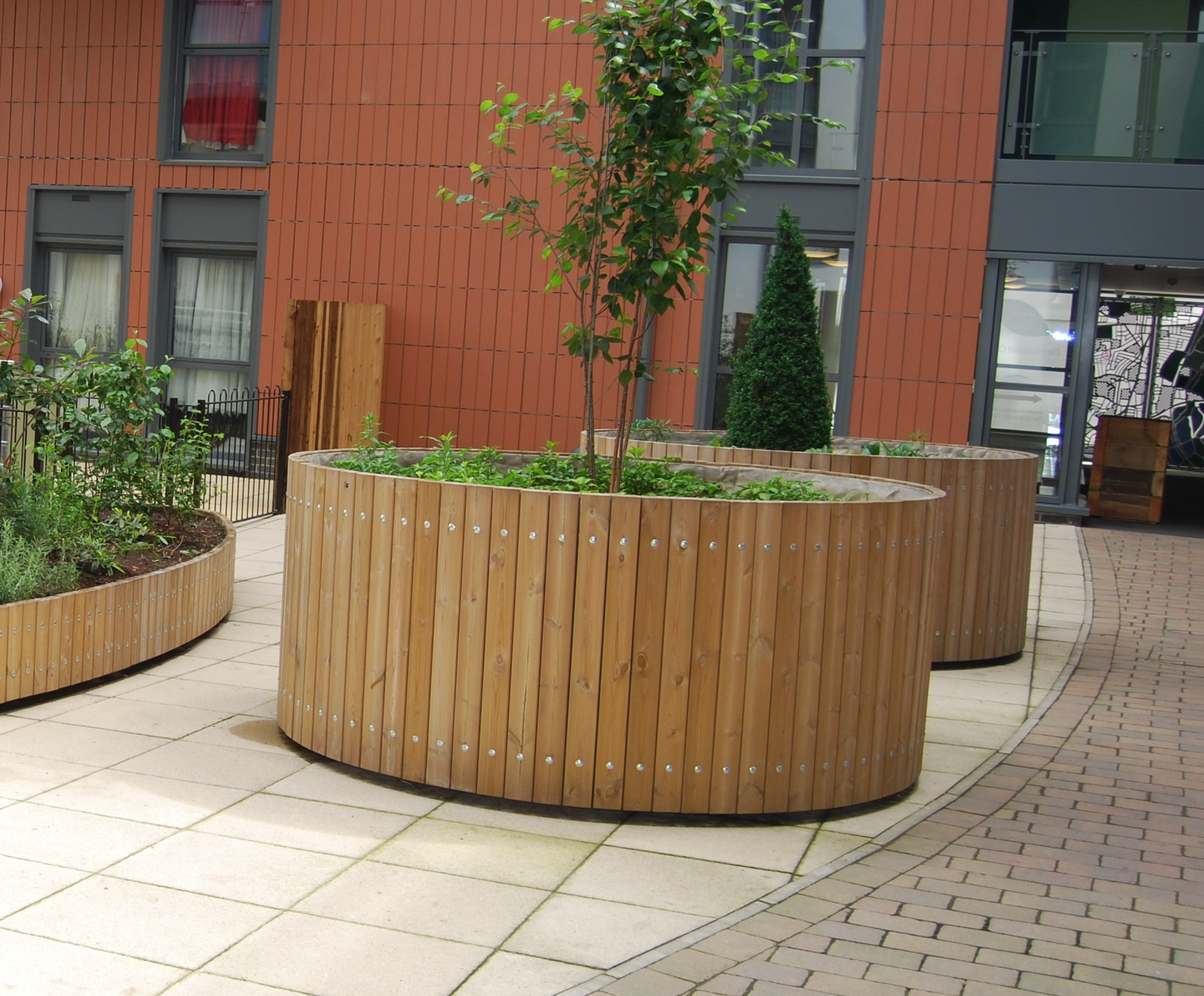 Swithland circular FSC timber tree planters | Street Design | ESI ...