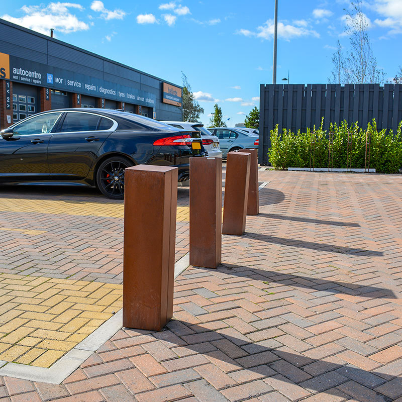 Corten steel bollards and cycle stands for retail park | Artform Urban ...