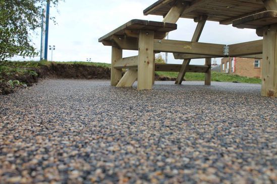 Recycled rubber and aggregate surfacing for seating area | Addagrip ...