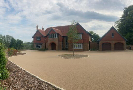 Seamless driveway created using Stonebound surfacing | Addagrip Terraco ...