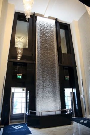 7m-tall AquaVeil® illuminated water wall for foyer | Tills Innovations ...