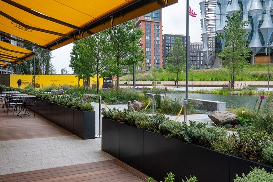 Bespoke steel planters for restaurant in Embassy Gardens | IOTA | ESI ...