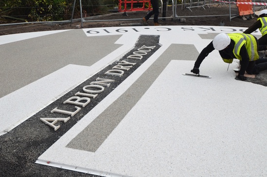 Resin bound wayfinding graphic with historical message | Clearstone ...