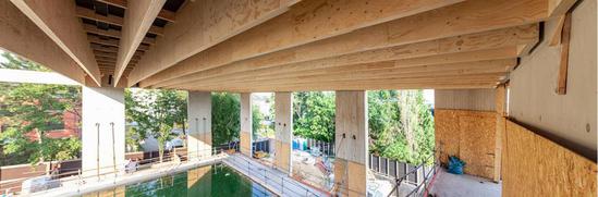 Kerto LVL roof beams for indoor swimming pool | Metsä Wood UK | ESI ...