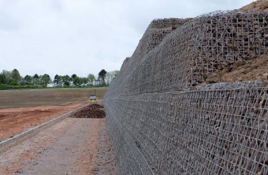 Award-winning reinforced soil bund for business park | Maccaferri | ESI ...