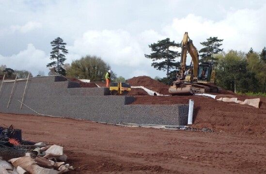 Award-winning reinforced soil bund for business park | Maccaferri | ESI ...