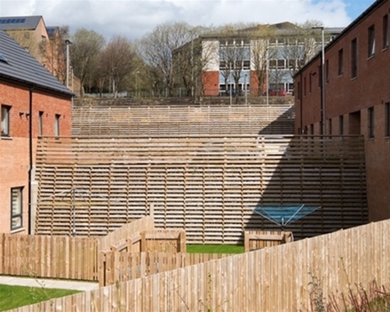 Timber retaining walls with fence extension for housing | Phi Group ...