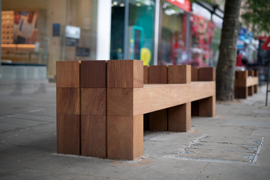 Beam timber benches line Kensington High Street | Woodscape | ESI ...