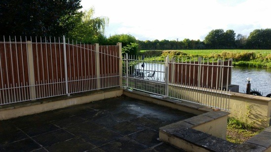Metal railings secure river bank property | Alpha Rail | ESI External Works