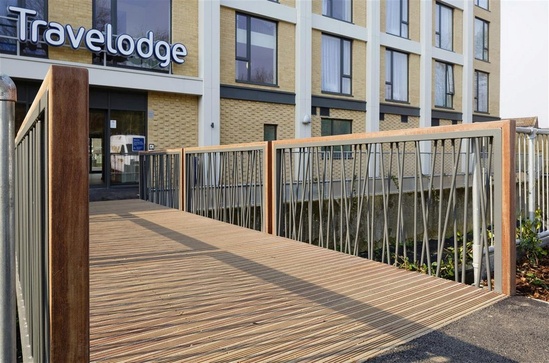 Bespoke steel and timber parapet bridge for Travelodge | CTS Bridges ...