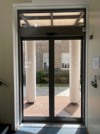IP65-rated automatic sliding external door at university | TORMAX UK ...