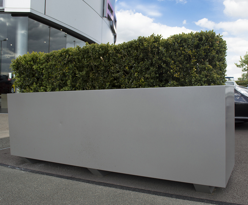 Bespoke movable steel planters for Porsche forecourt | IOTA | ESI ...