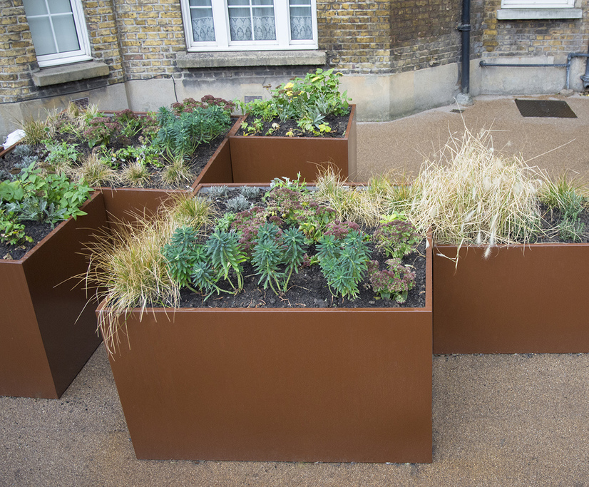 Bespoke powder-coated steel planters for Devon Mansions | IOTA | ESI ...