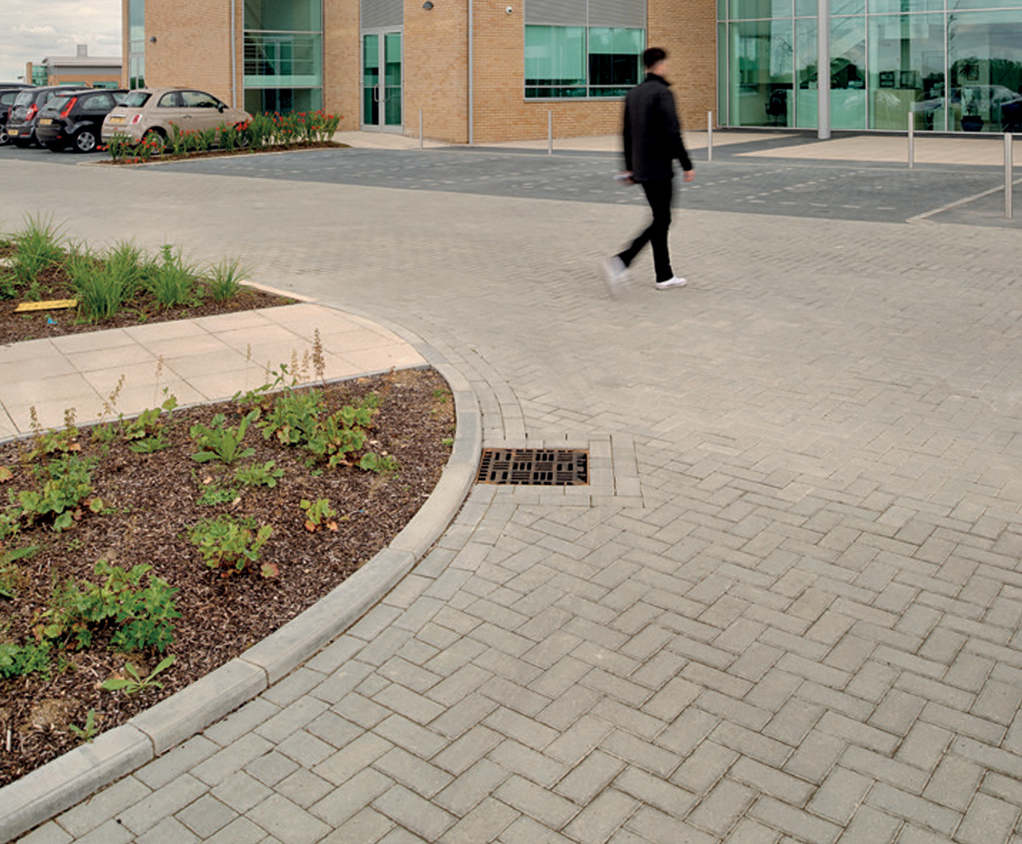 Neutral concrete paving products for landscaped setting | Marshalls ...