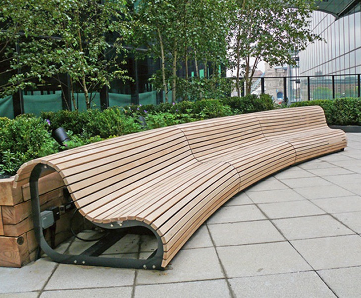 Corkscrew hardwood timber curved seat | Woodscape | ESI External Works