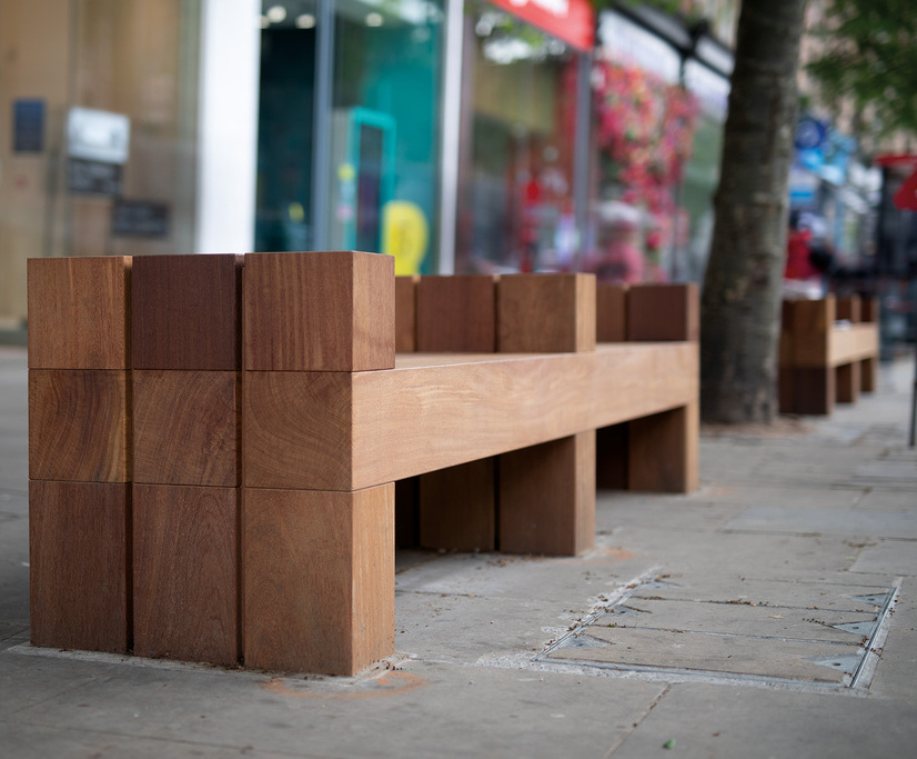 Beam timber benches line Kensington High Street | Woodscape | ESI ...