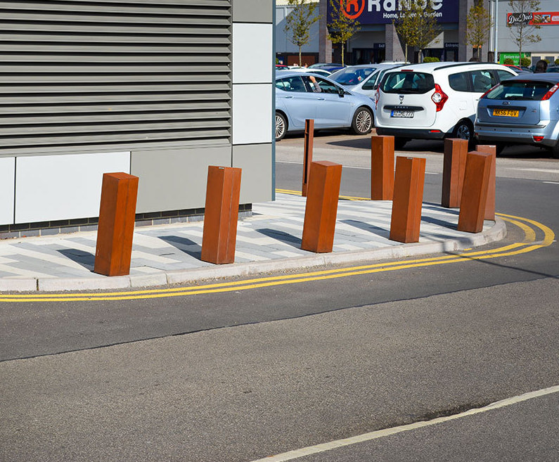 Corten steel bollards and cycle stands for retail park | Artform Urban ...