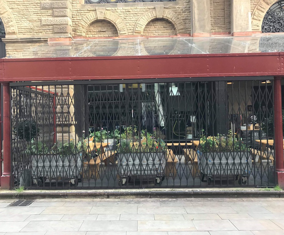 Collapsible gates secure Mackie Mayor, Manchester | Bolton Gate Company ...