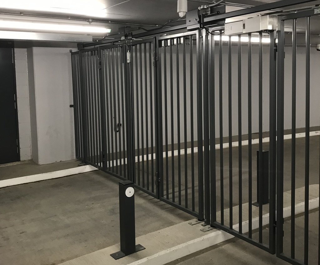 Bi-folding gates secure car park for Chelsea apartments | Bolton Gate ...